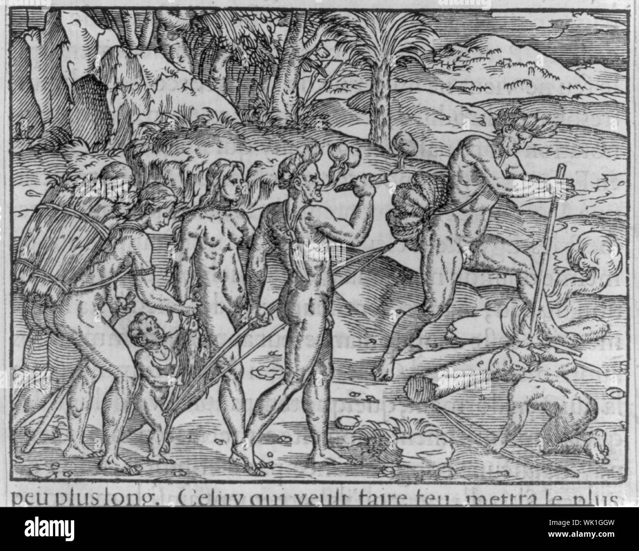 Indigenous people in domestic activities, one of whom is making a fire ...