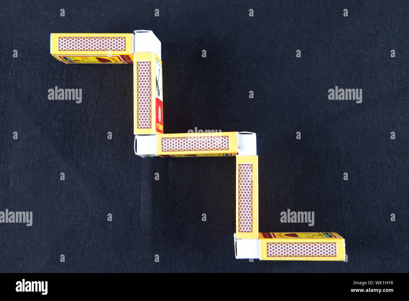Matchbox representing line graph Stock Photo - Alamy