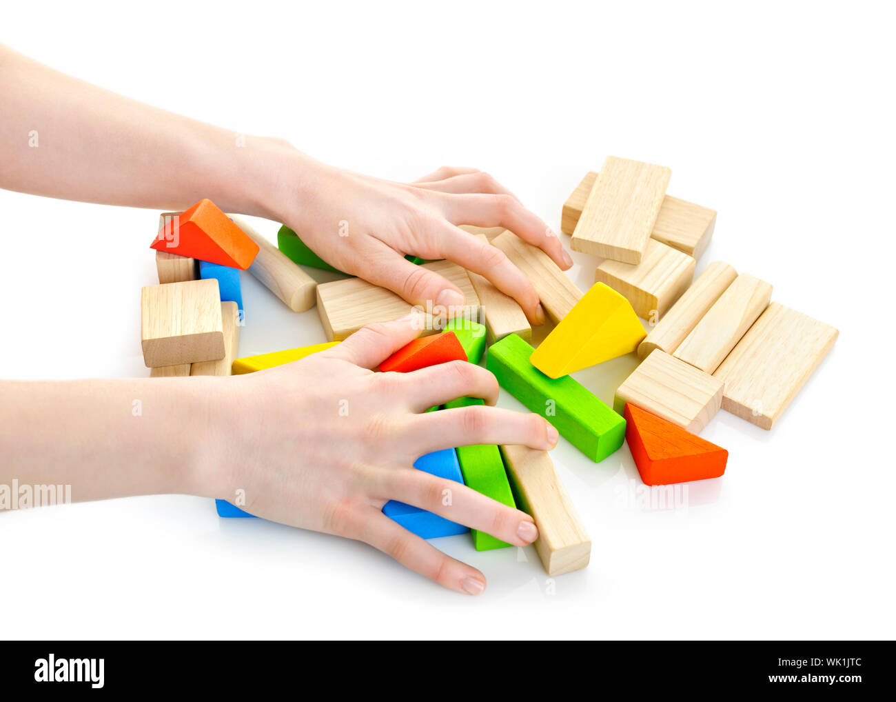 Hands with pile of wooden block toys isolated on white Stock Photo - Alamy
