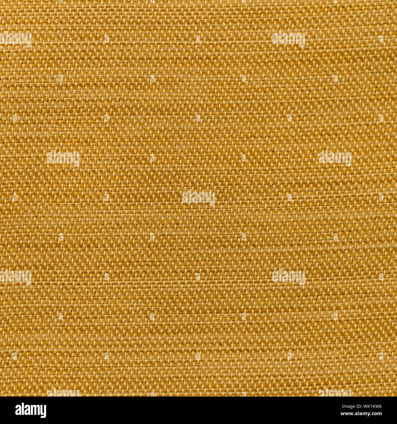 Closeup detail of yellow fabric texture background Stock Photo - Alamy