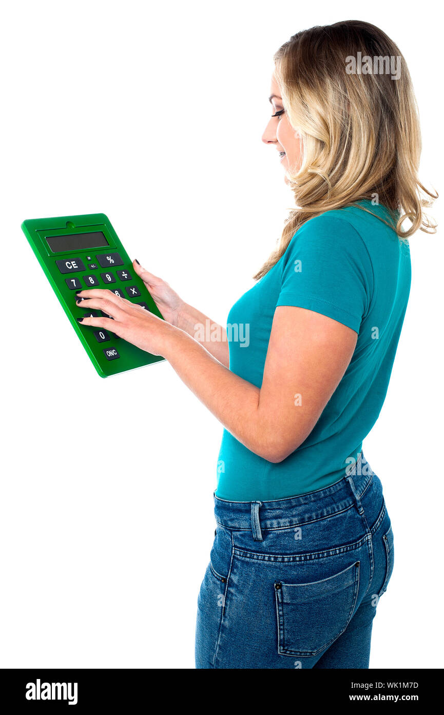 Teen girl using a big calculator Stock Photo - Alamy