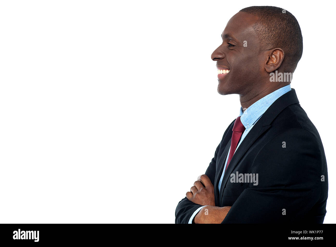 Side pose of smart young business executive Stock Photo - Alamy