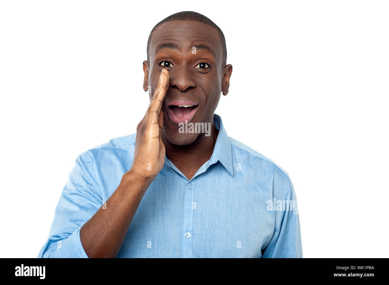 Smart young man telling some secrets Stock Photo - Alamy