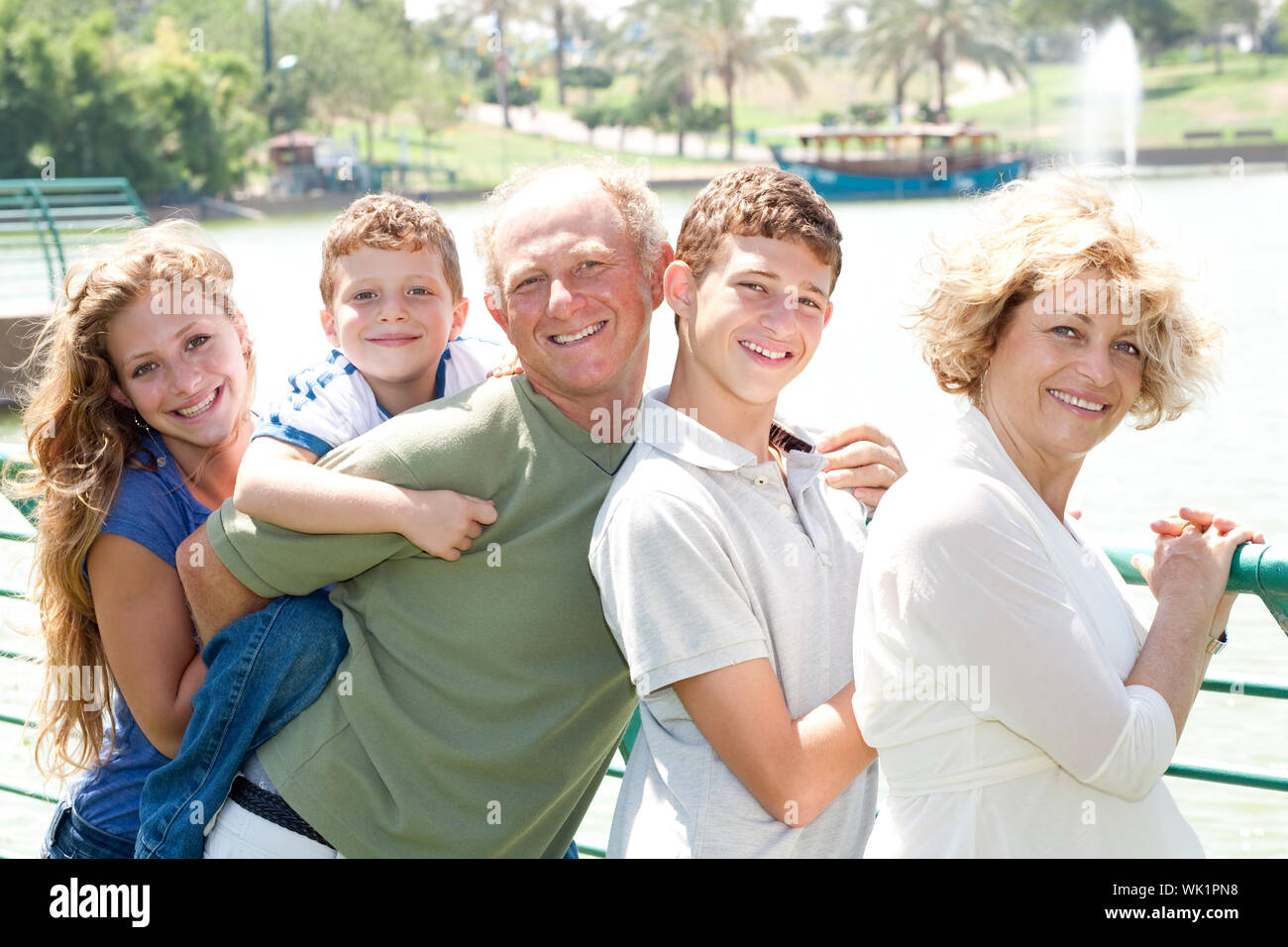 Closeup portrait of a happy family standing together in outdoor Stock ...