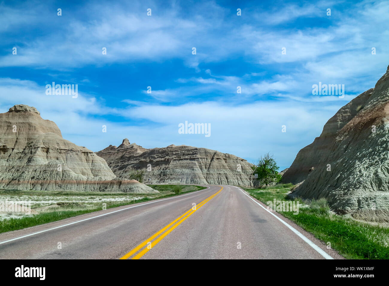 A long way down the road of Badlands National Park, South Dakota Stock ...