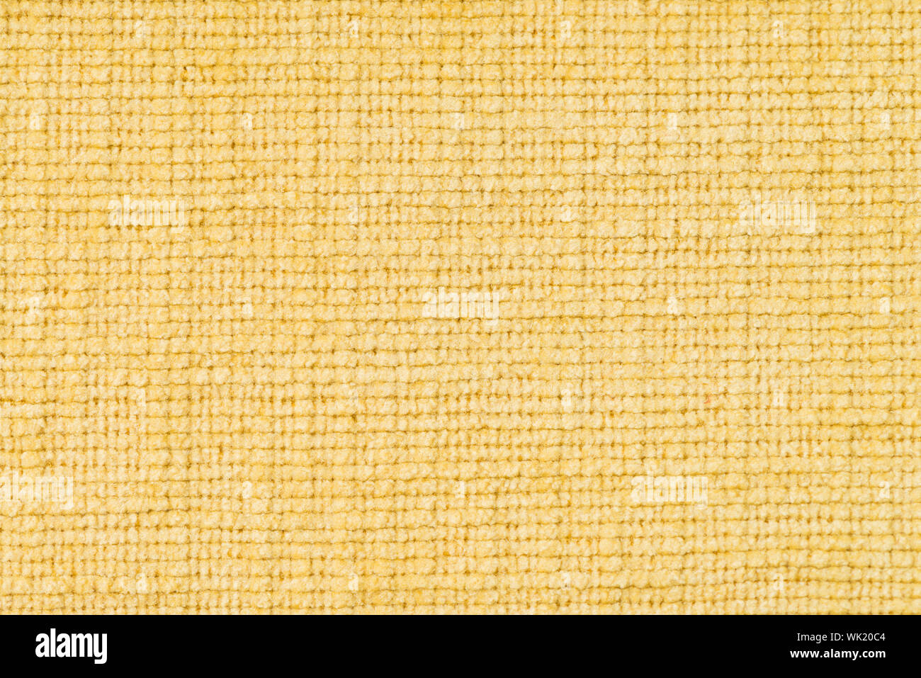 Closeup detail of yellow fabric texture background Stock Photo - Alamy