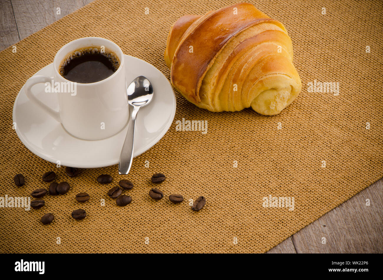 Cup of black coffee over sackcloth baclground Stock Photo - Alamy