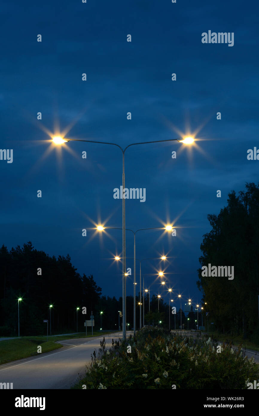 Light poles at dusk night Stock Photo - Alamy