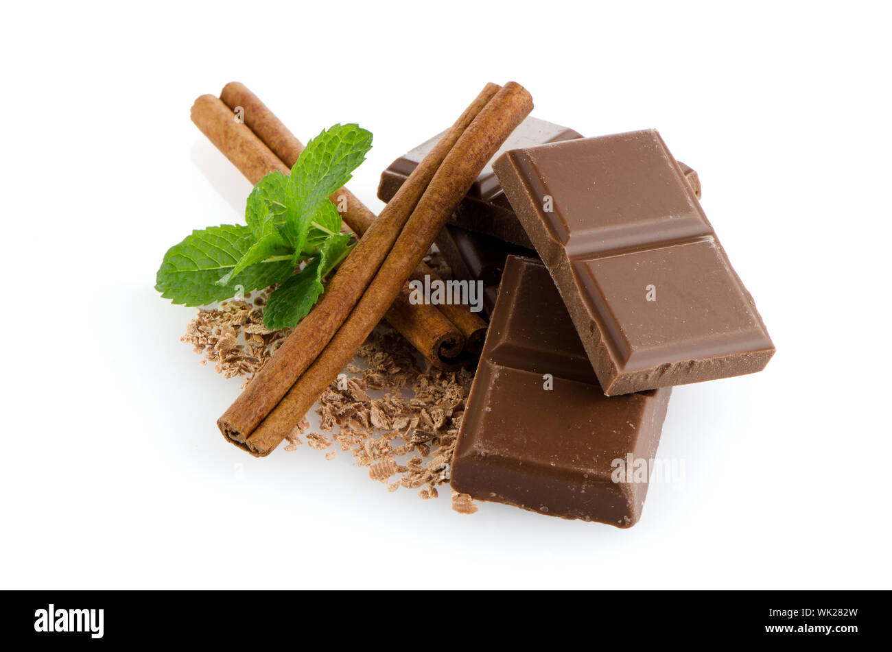 Chocolate parts and cinnamon sticks isolated on white background Stock ...