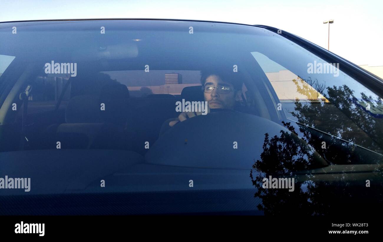 Man Driving Car Seen Through Windshield Stock Photo - Alamy