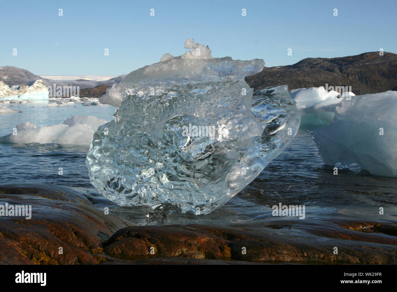 Ice diamond stranded on the rocks Stock Photo - Alamy