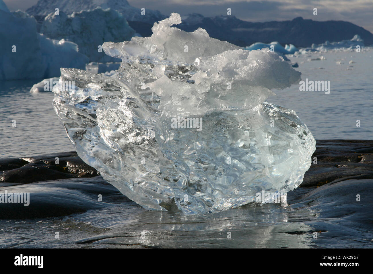 Ice diamond stranded on the rocks Stock Photo - Alamy