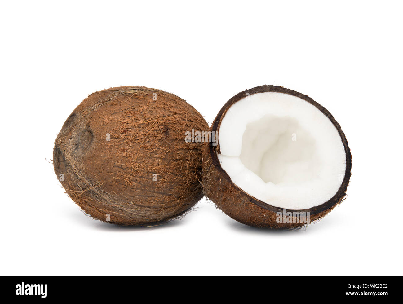 coconut cut in half on white background Stock Photo - Alamy