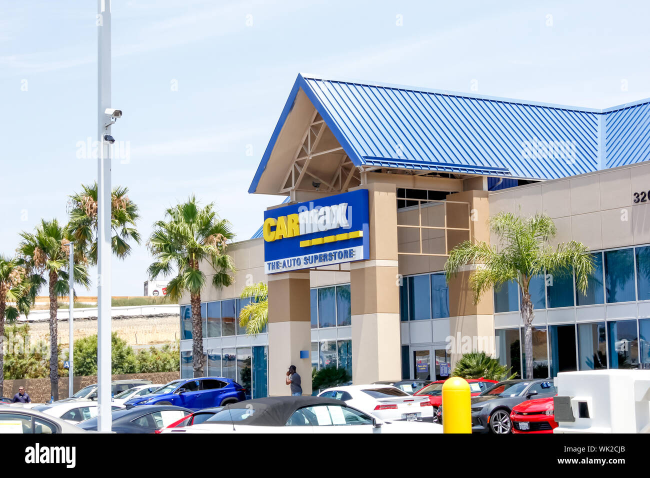 A view of the building sign and entrance area to the used card ...