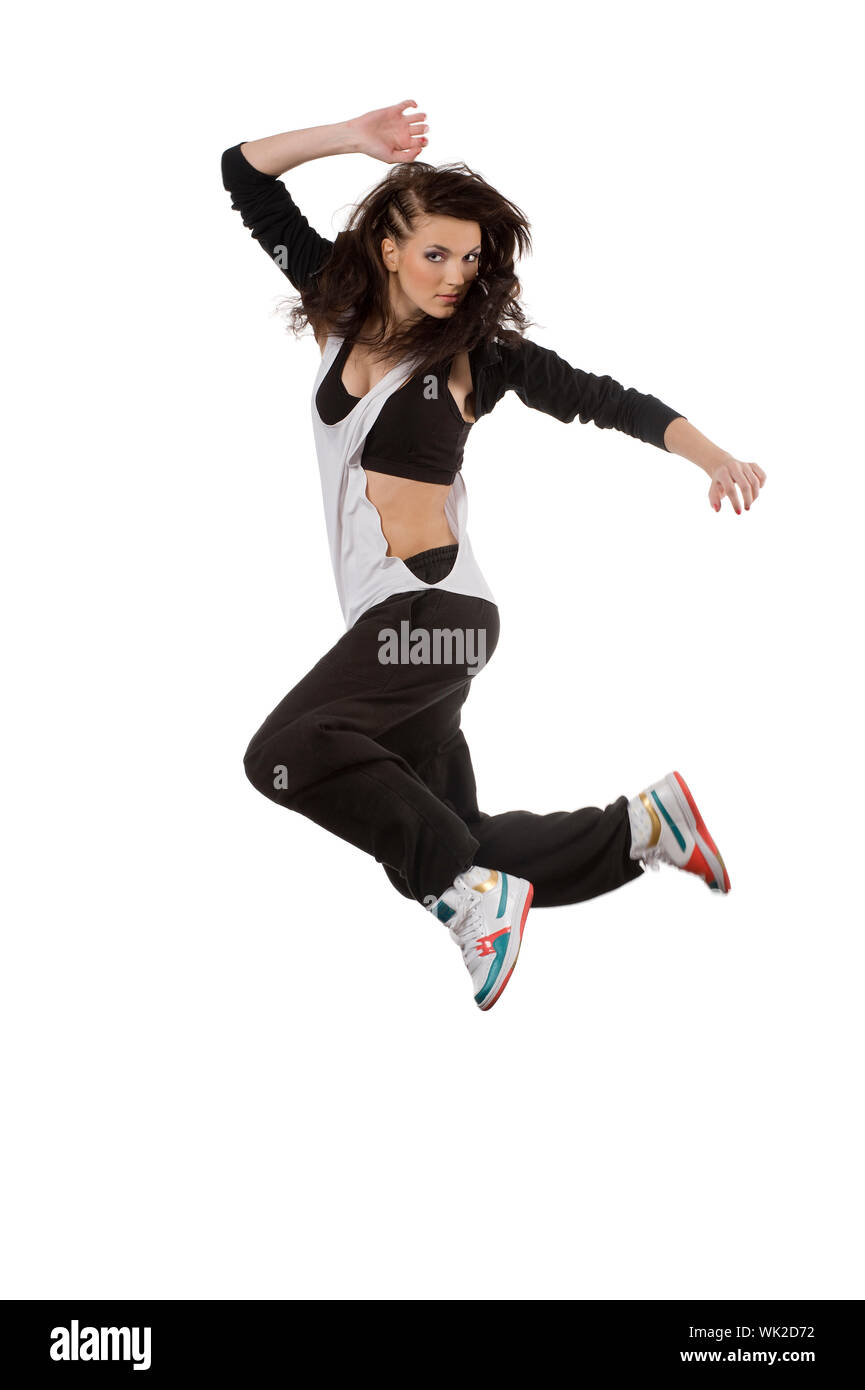 cute young dancer in modern style taking a flying ballet pose over ...