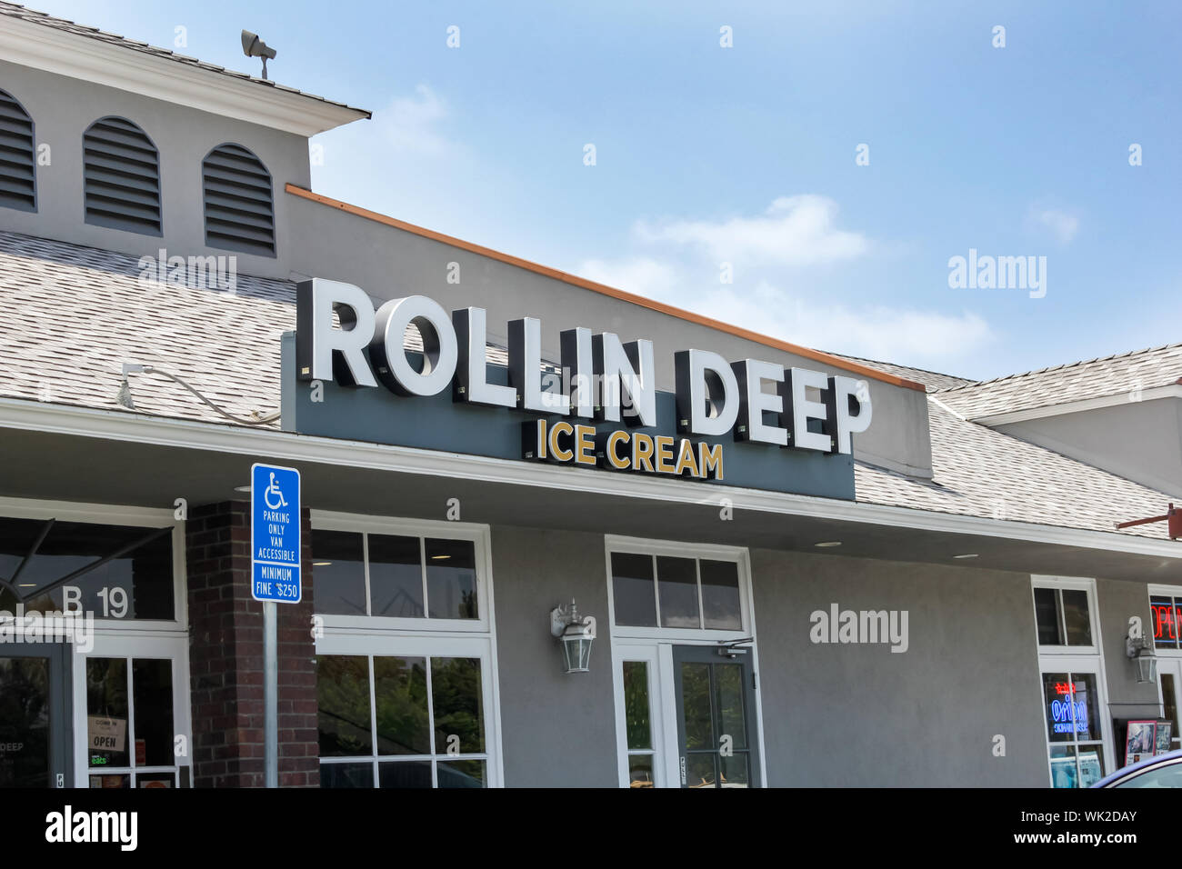 A store front sign for the rolled iced cream shop known as Rollin Deep ...