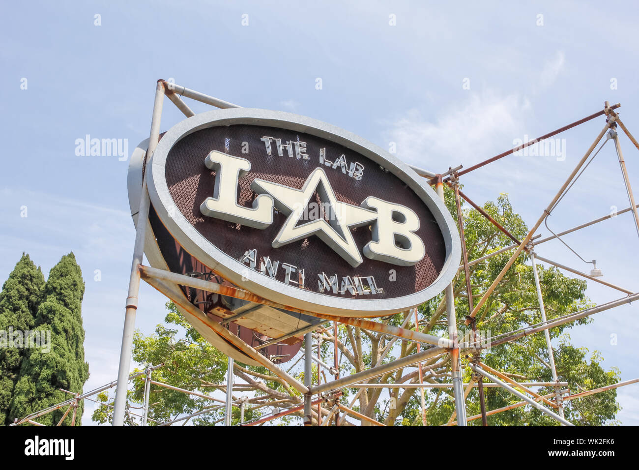 A street side and entrance sign for the shopping center known as The ...