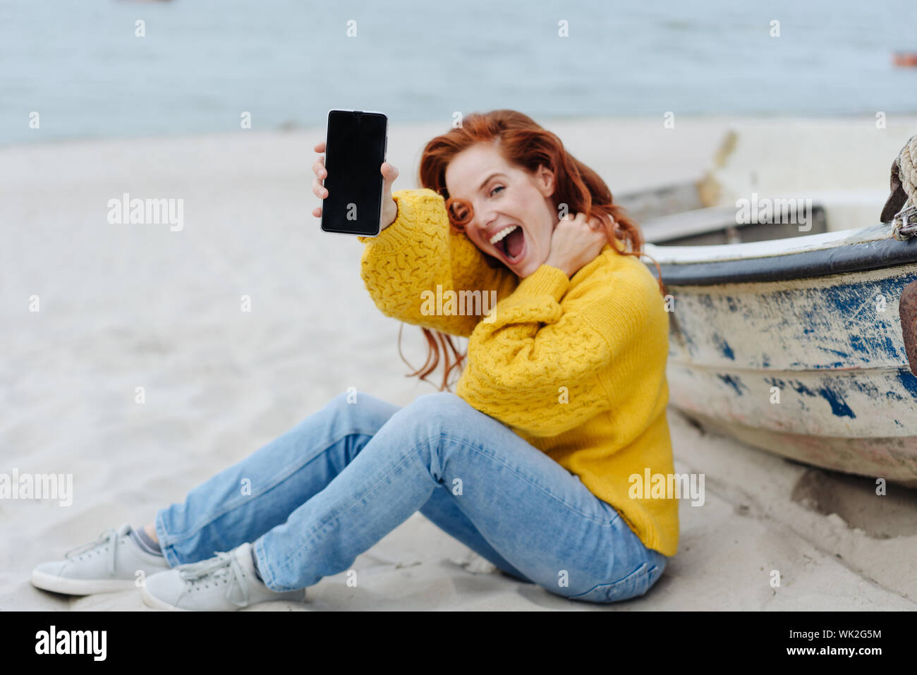 Woman laughing in dinghy in hi-res stock photography and images - Alamy