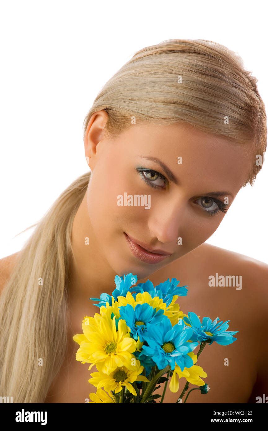 graceful model with colored make up and some flowers near face Stock ...