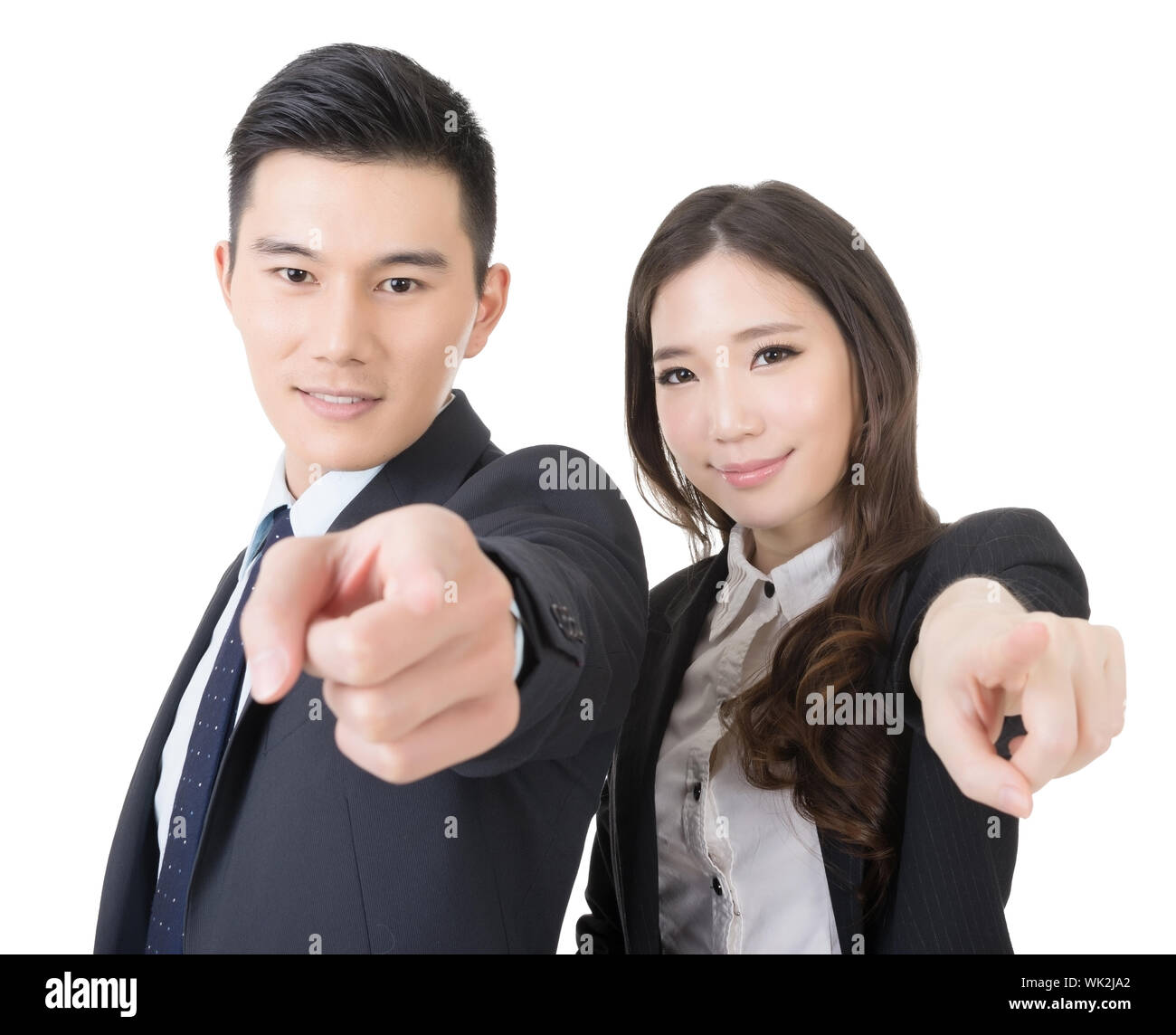Business man and woman point at you, closeup portrait isolated on white ...