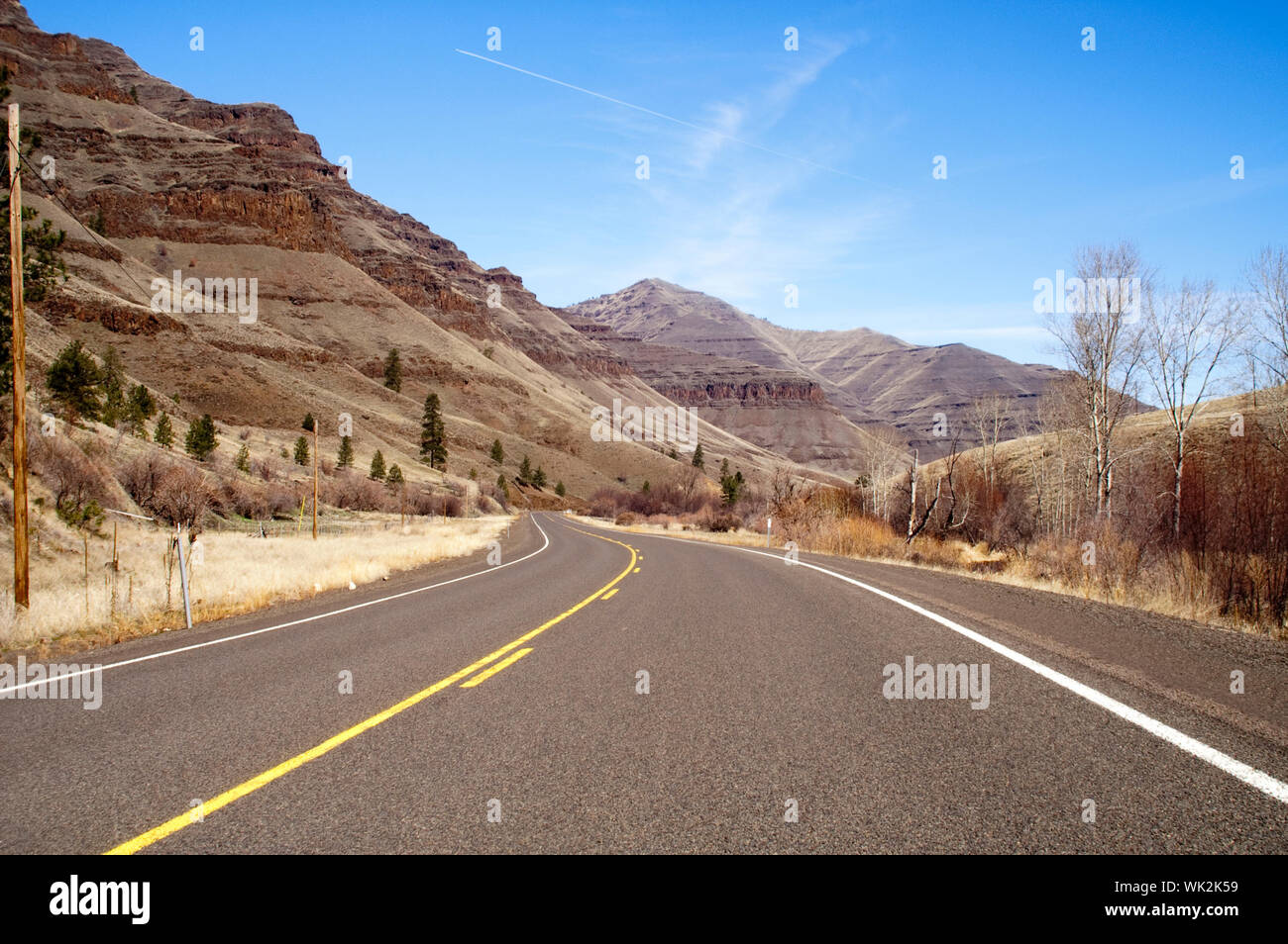 Two lane road leads off into the distance Stock Photo - Alamy