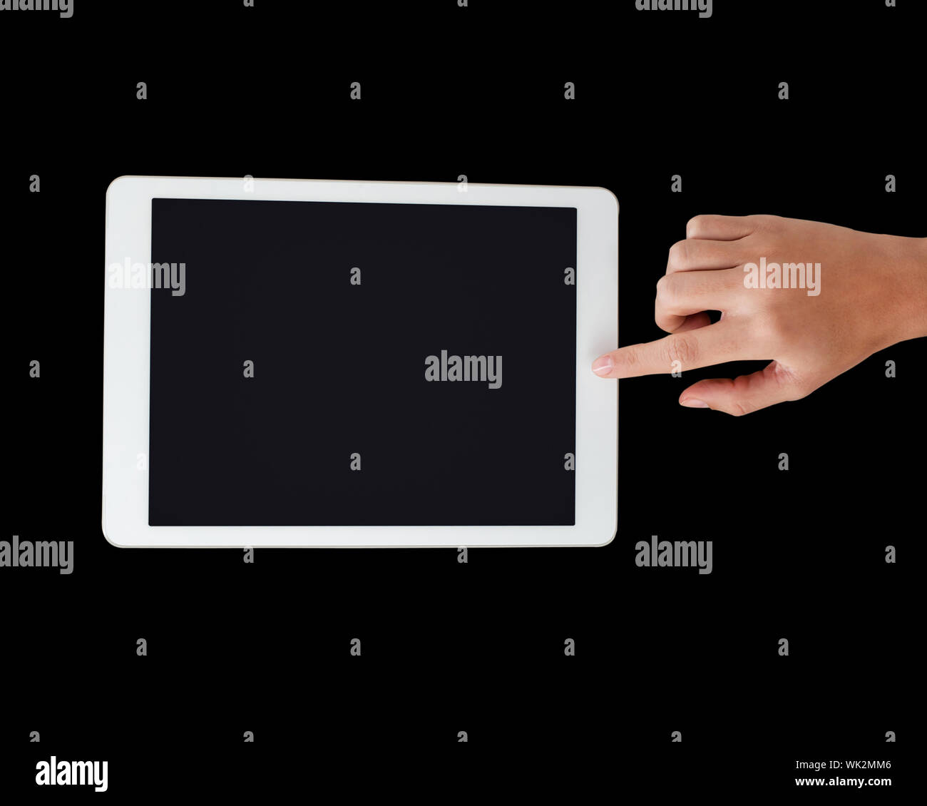 Finger pointing on tablet screen Stock Photo - Alamy