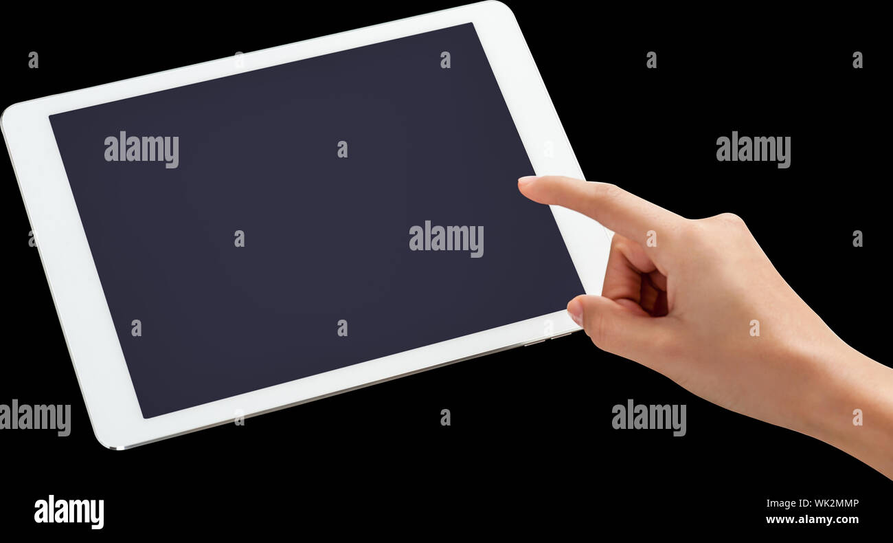 Womans finger pointing on tablet screen Stock Photo - Alamy