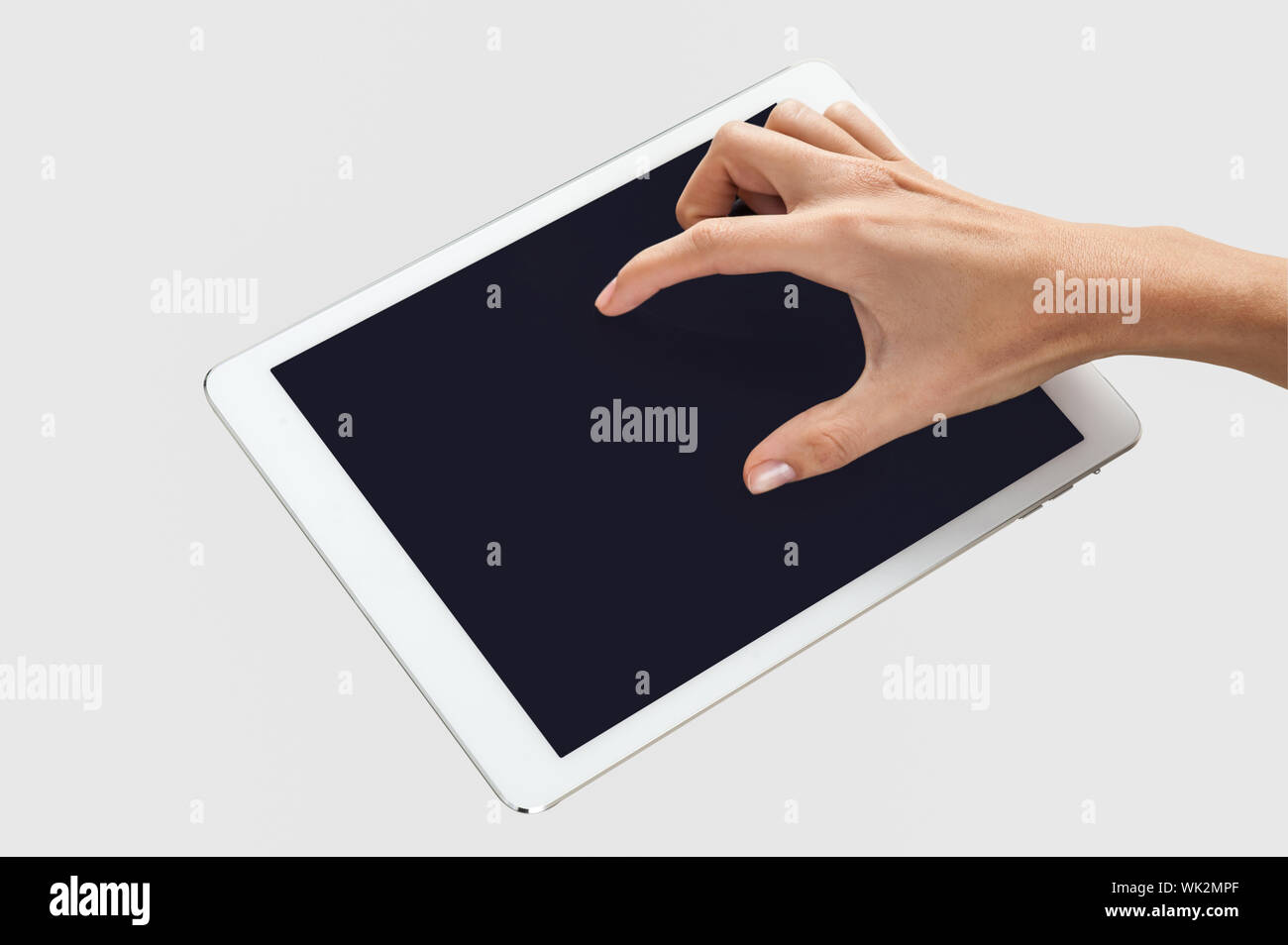 Finger touching digital tablet screen Stock Photo - Alamy