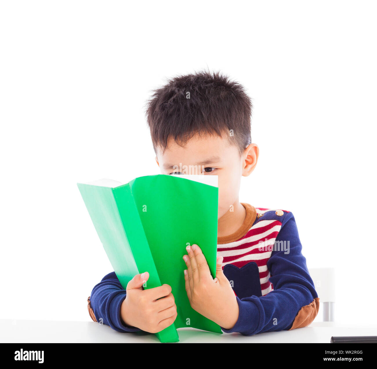 Asian kid reading a book Stock Photo - Alamy