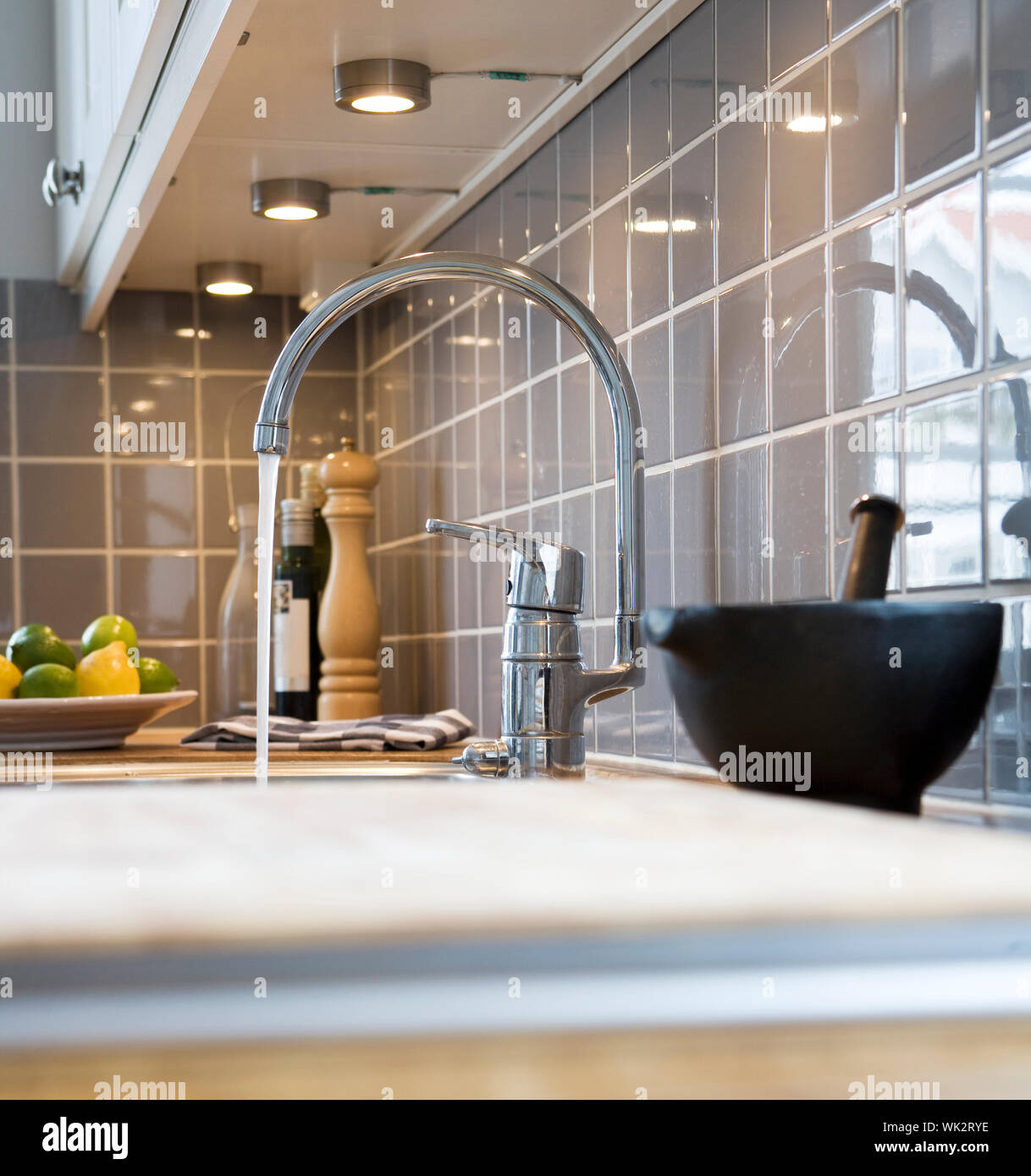 Pouring water in the kitchen Stock Photo - Alamy