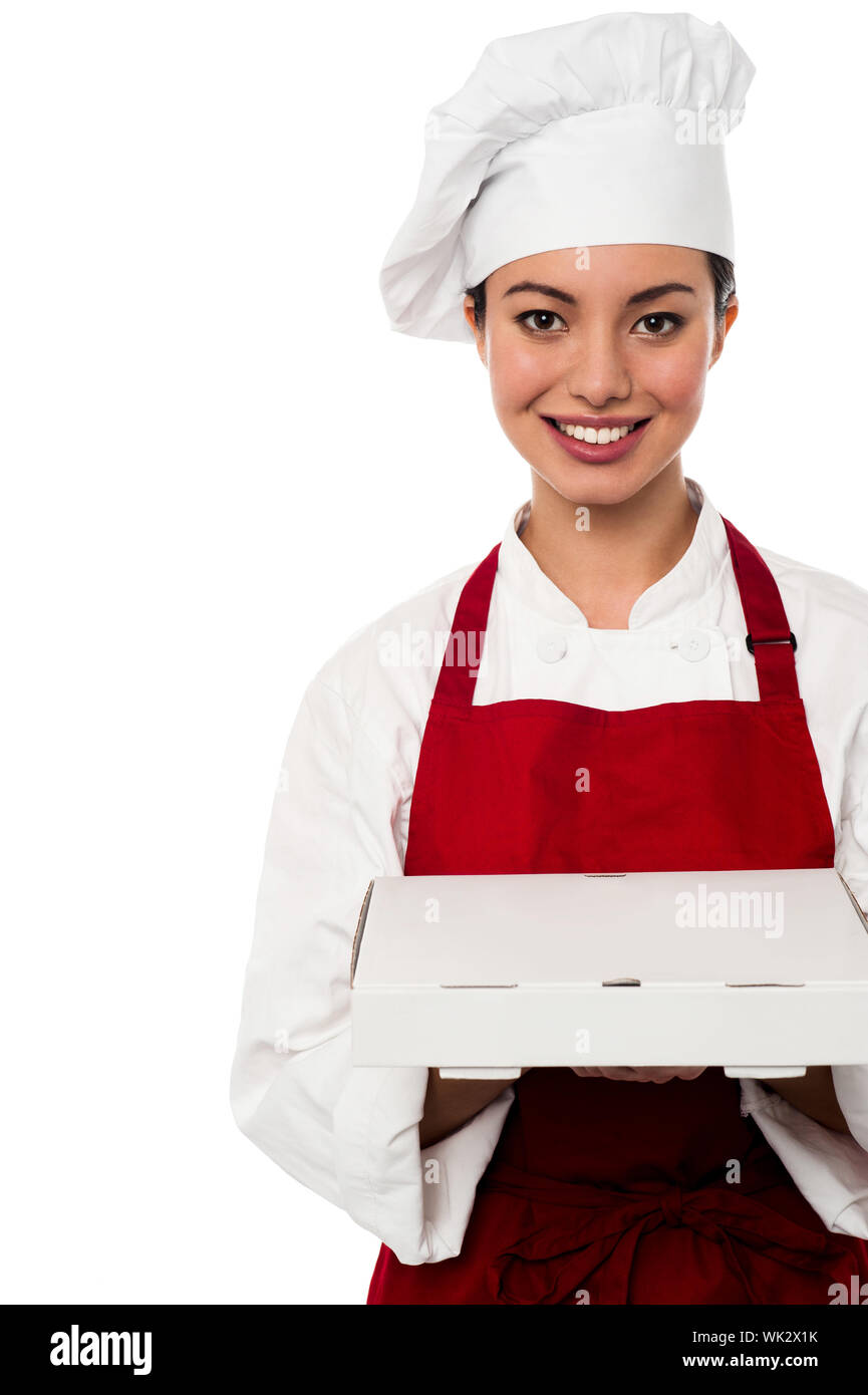 Young female chef delivering pizza Stock Photo - Alamy