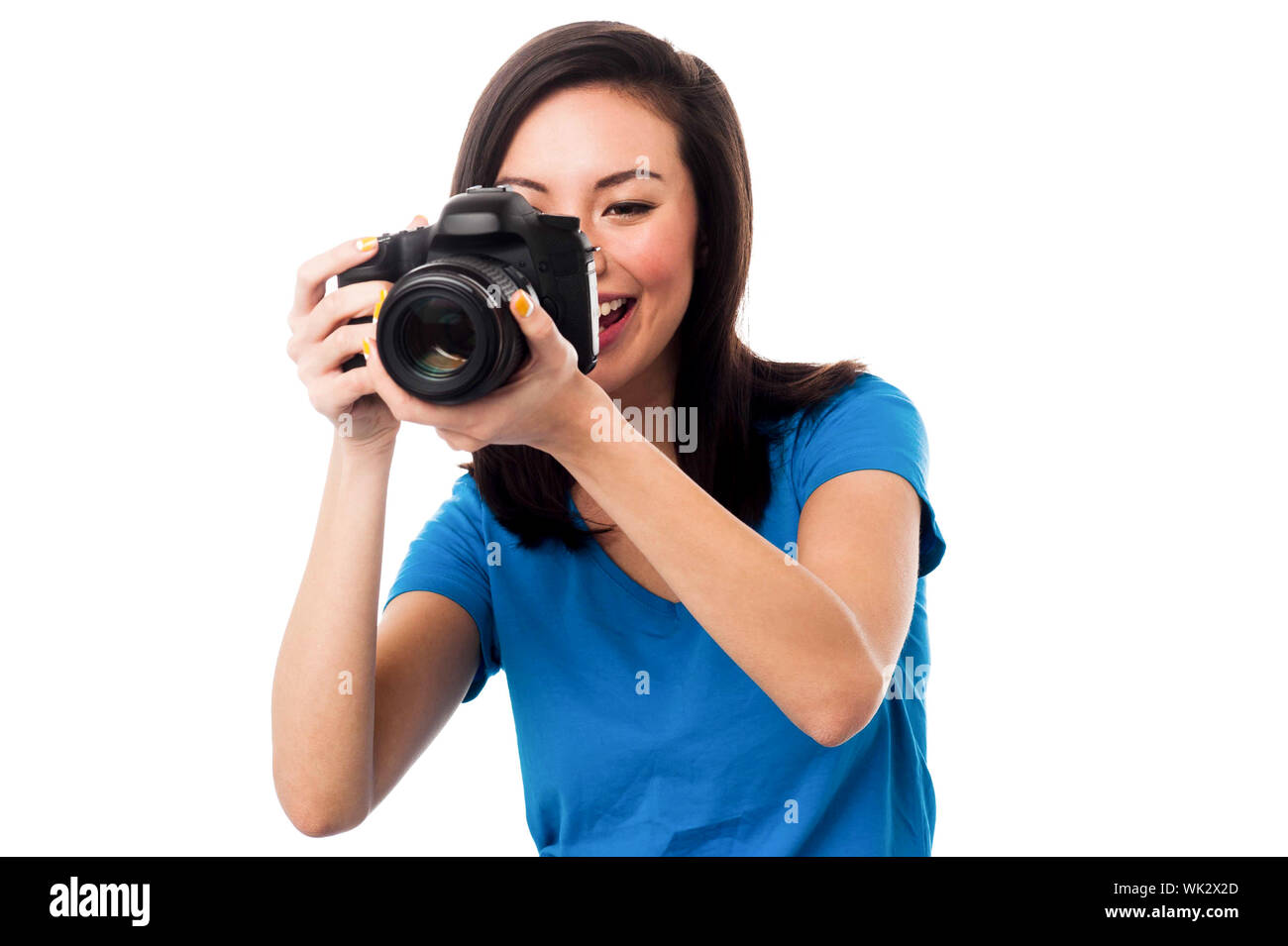Beautiful female photographer taking a snap Stock Photo - Alamy