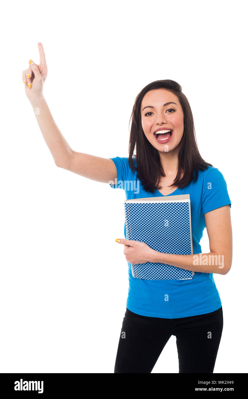 Female student raising her arm up and holding notebook Stock Photo - Alamy
