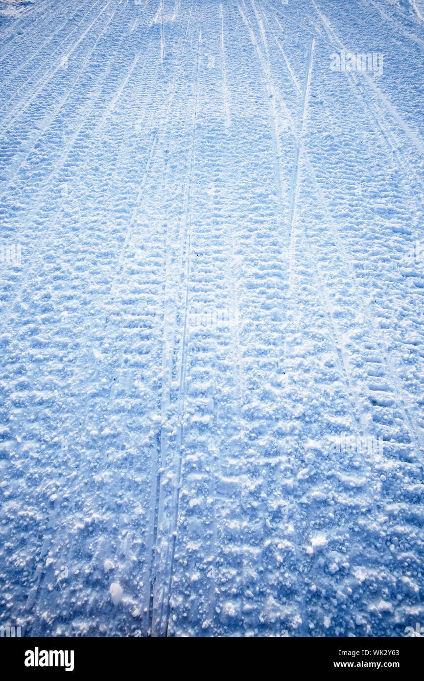 Snow texture background from snowmobile tracks Stock Photo - Alamy
