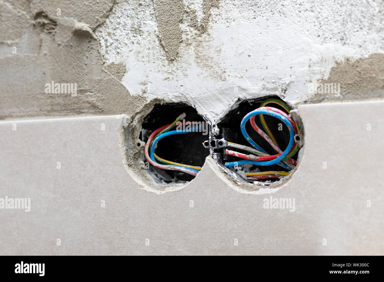 Close up picture of electric wires and sockets on the wall. Renovation ...