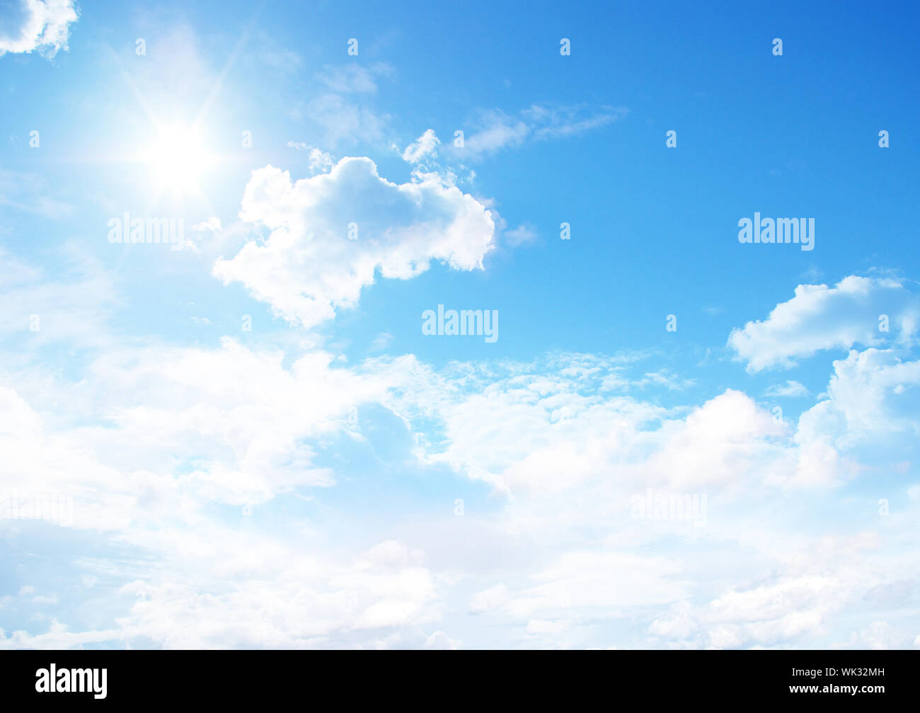 Blue sky with clouds and sun Stock Photo - Alamy