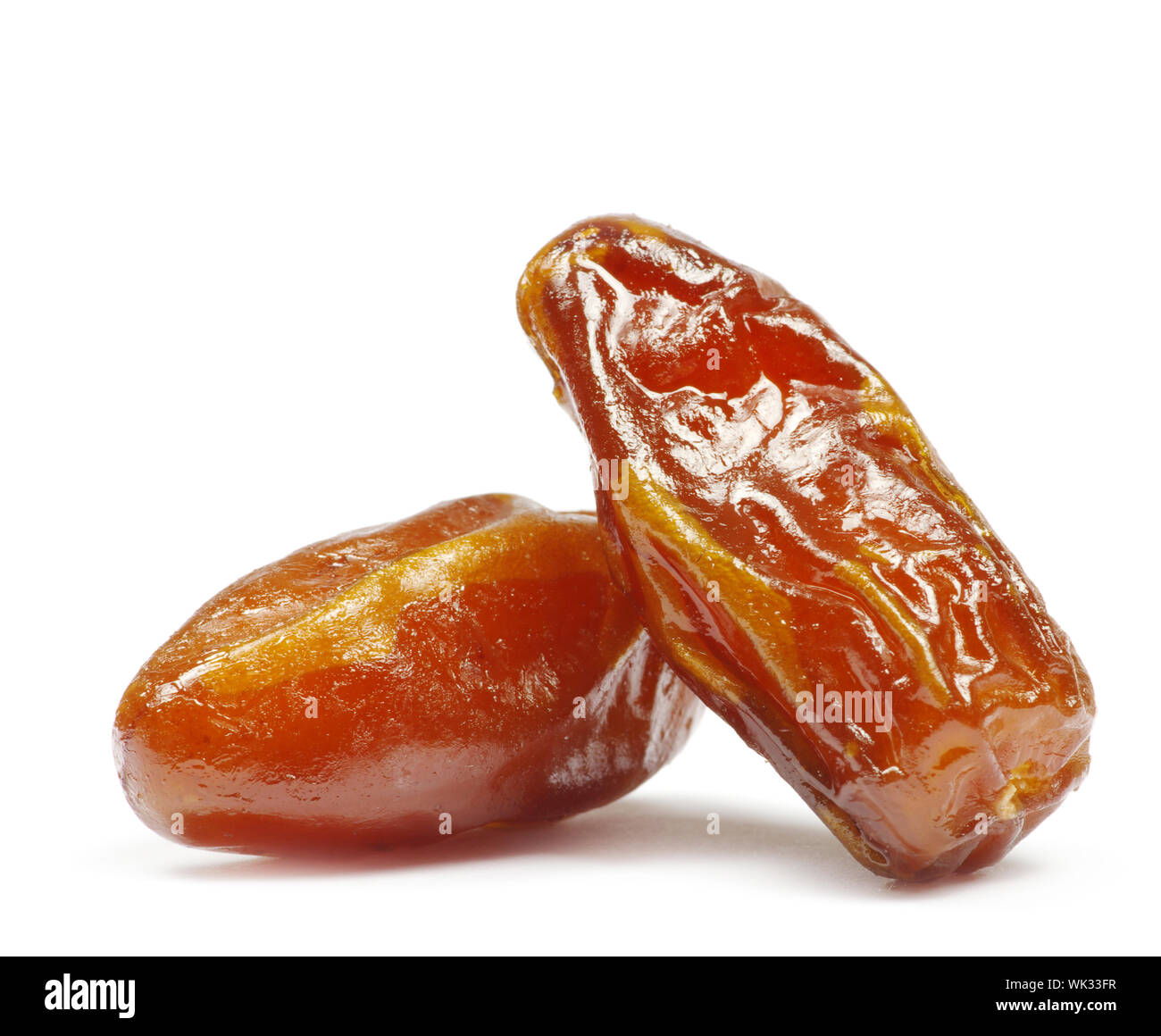 dryed dates on white background Stock Photo - Alamy