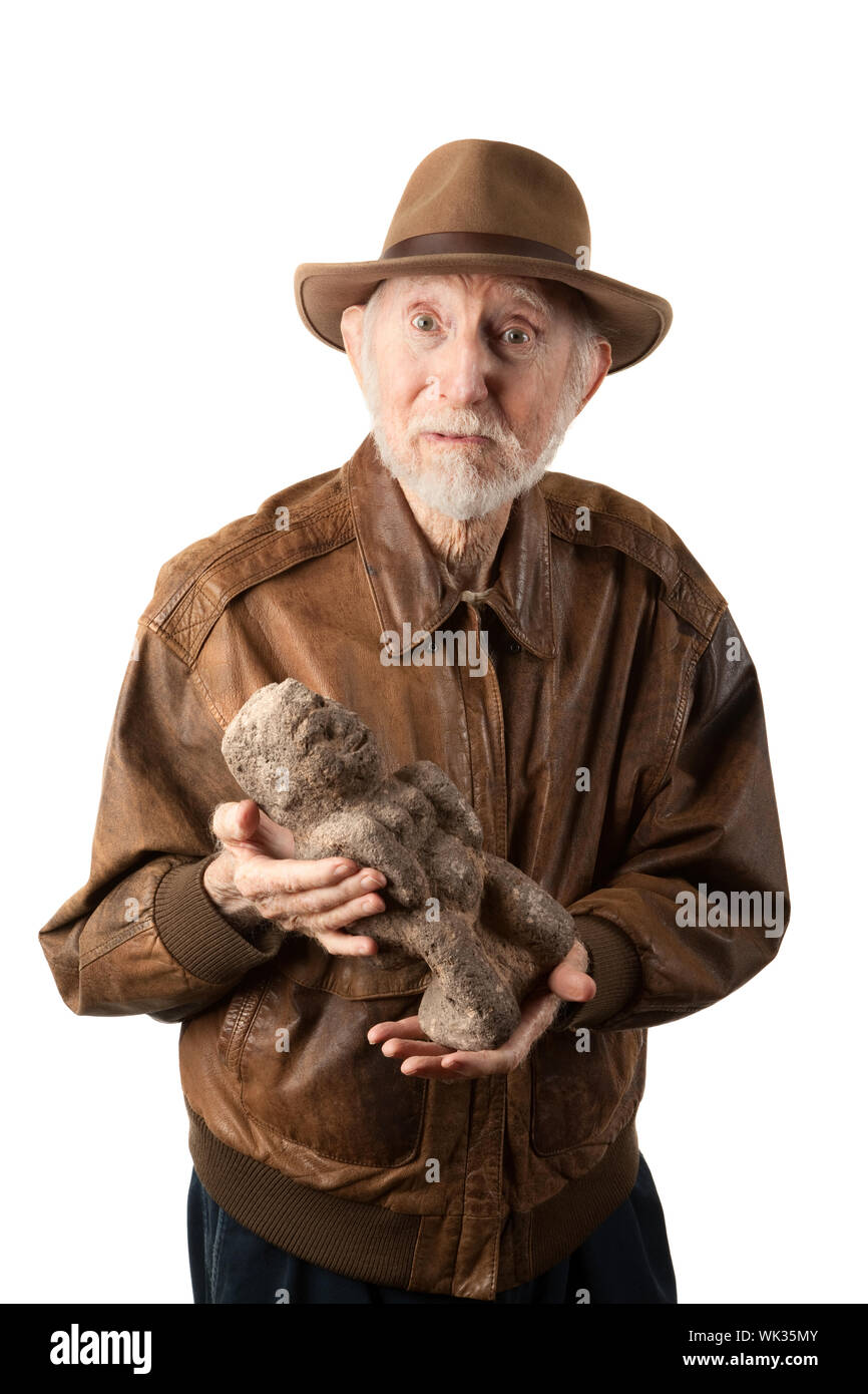 Adventurer or archaeologist in brown leather jacket with idol Stock ...