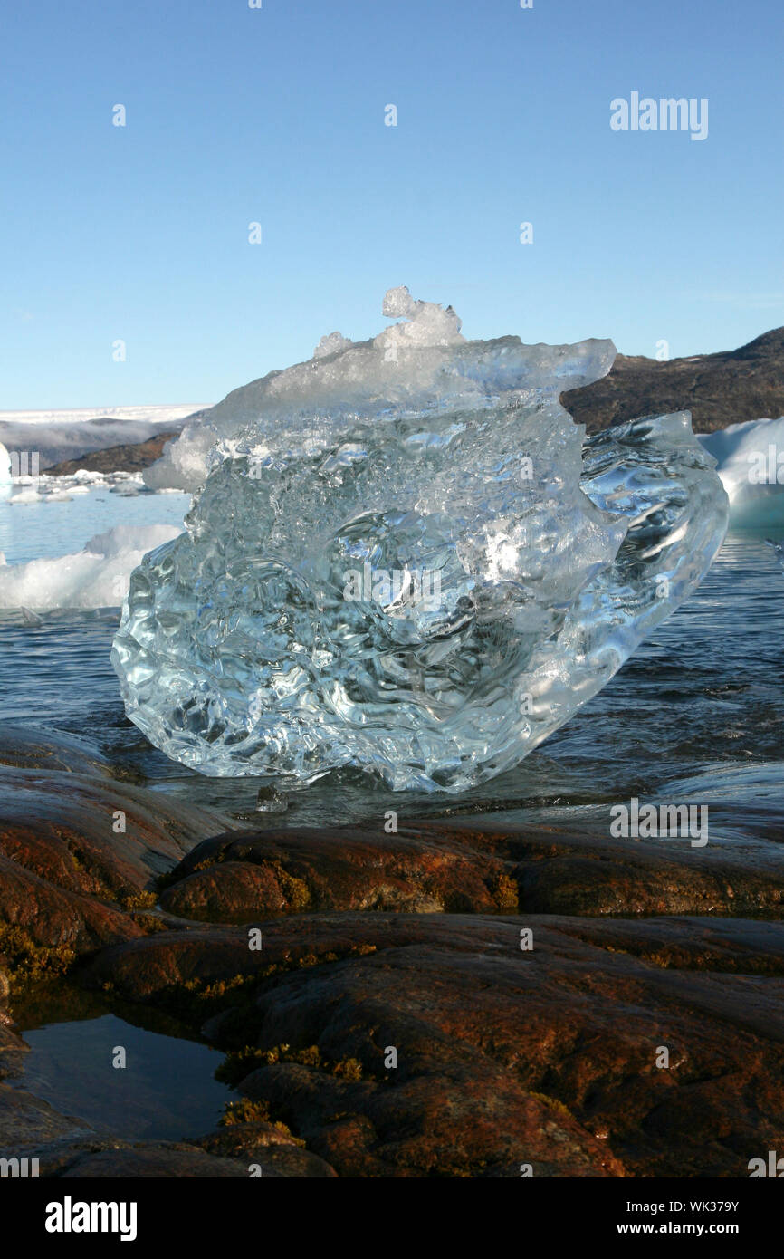 Ice diamond stranded on the rocks Stock Photo - Alamy