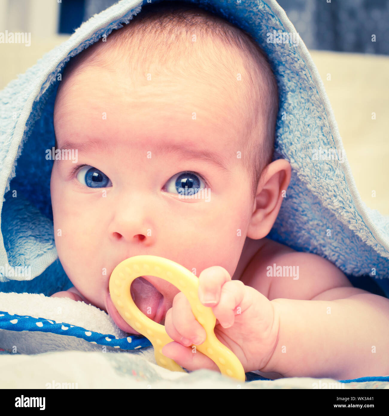 Little baby girl playing with teething toy Stock Photo - Alamy
