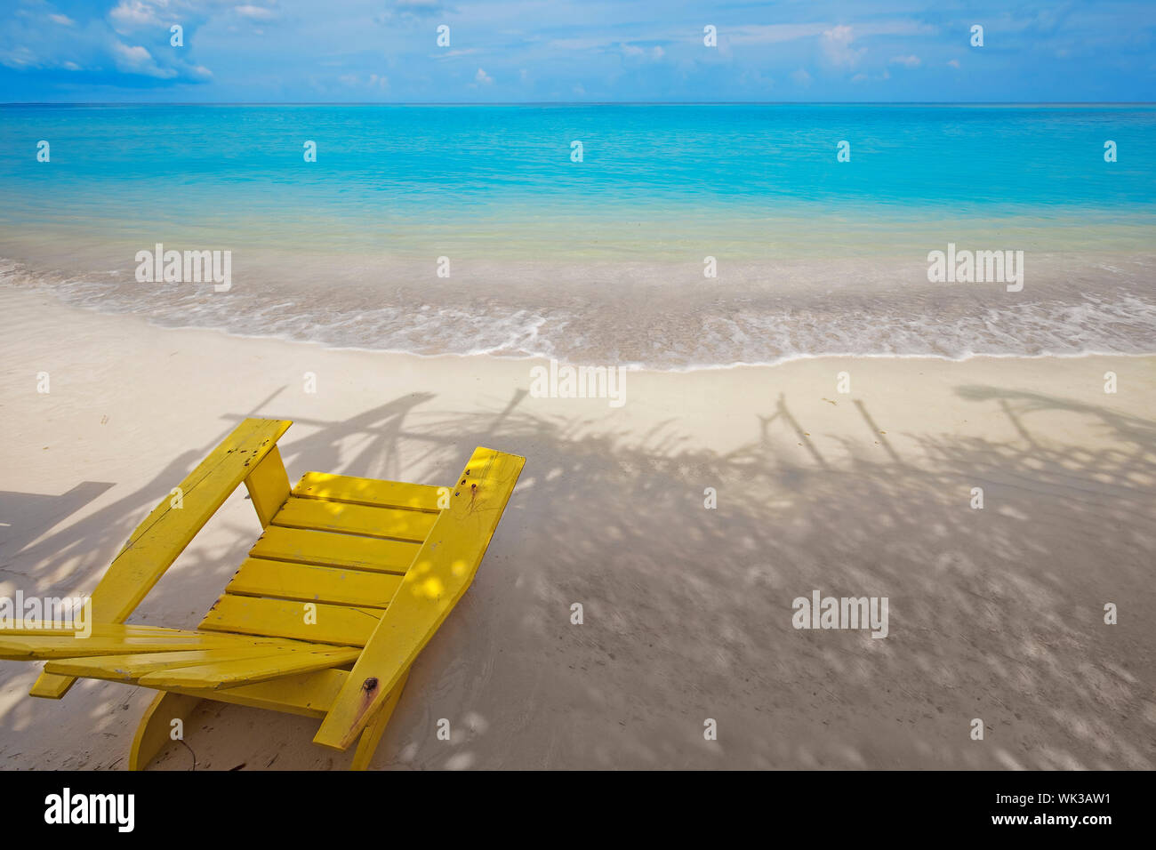 Wooden chair on a beautiful tropical beach Stock Photo - Alamy