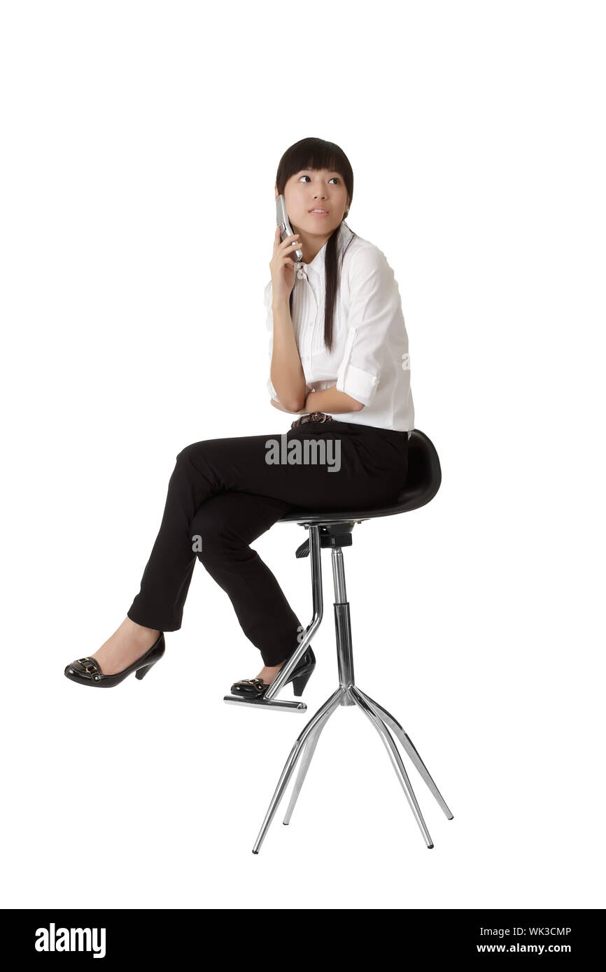 Business woman talking on phone and siting on chair, isolated on white ...