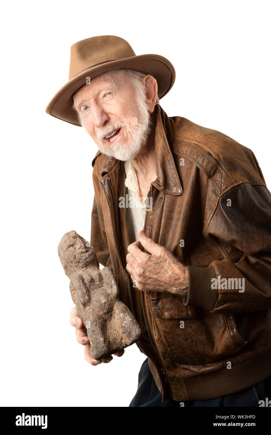 Adventurer or archaeologist in brown leather jacket with idol Stock ...