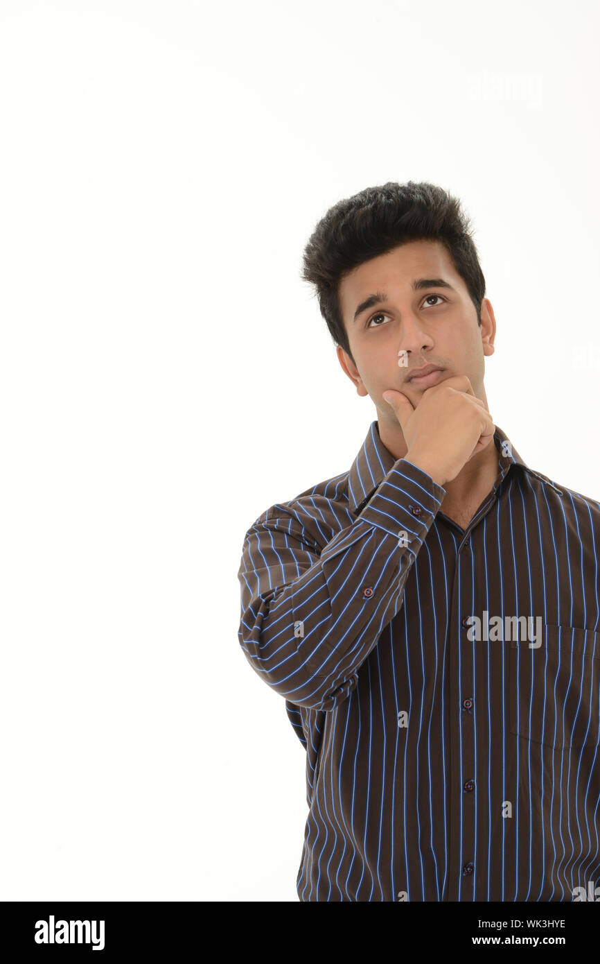 Indian young man thinking Stock Photo - Alamy