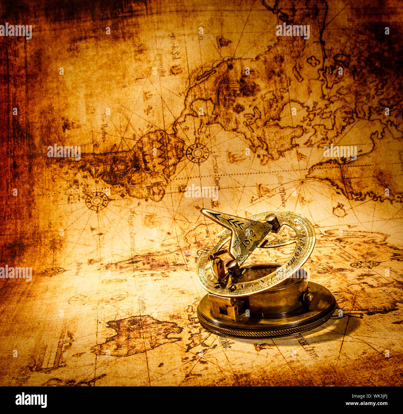 Vintage still life. Vintage compass lies on an ancient world map Stock ...