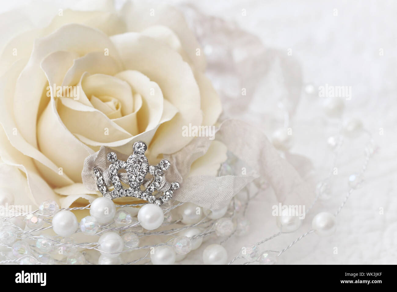 Cream color rose with jeweled crown Stock Photo - Alamy