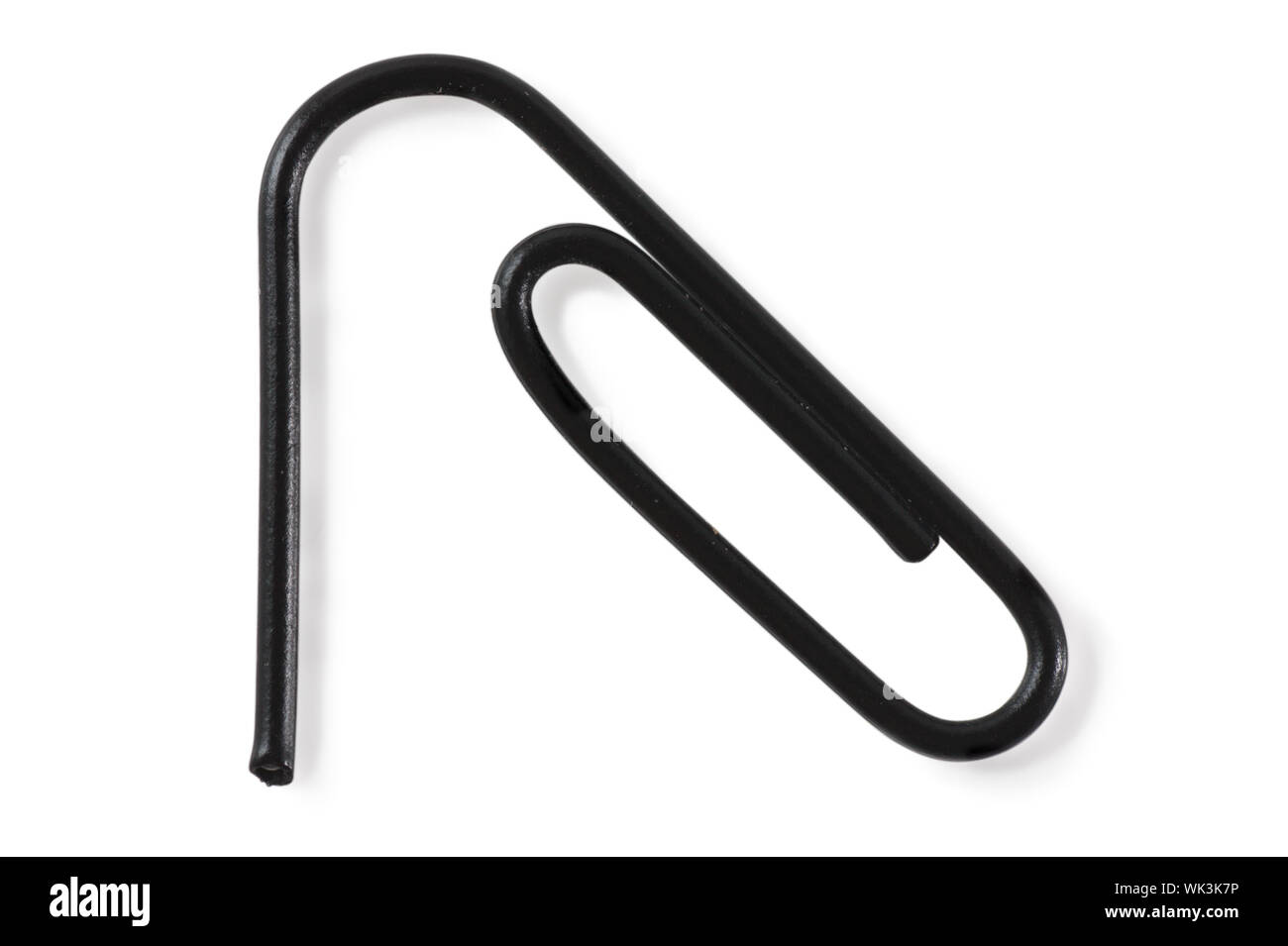 Macro view of black paper clip isolated over white Stock Photo - Alamy