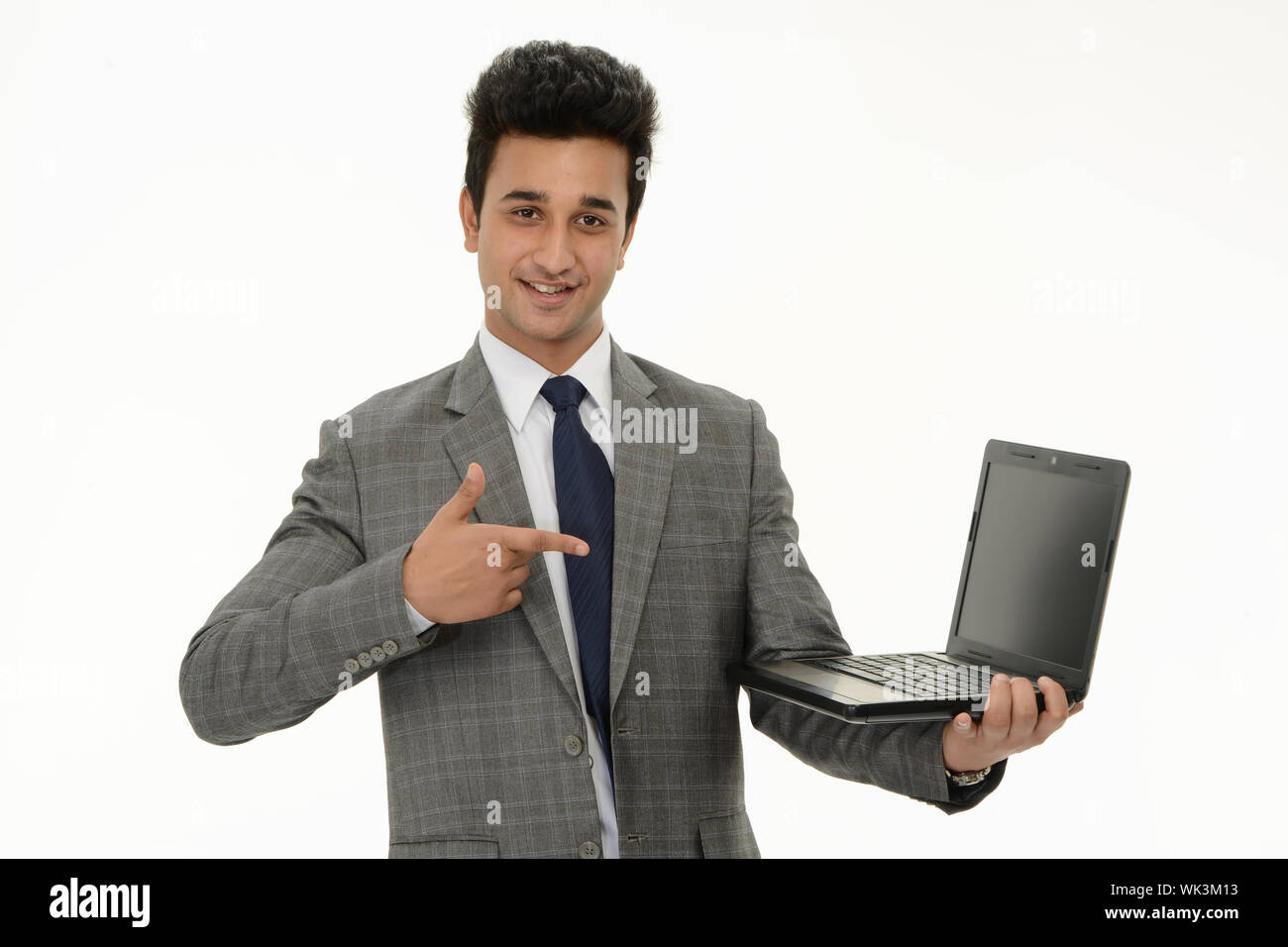 Salesman showing a laptop Stock Photo - Alamy