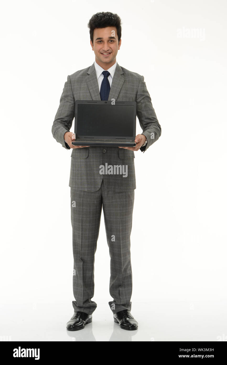 Salesman showing a laptop Stock Photo - Alamy