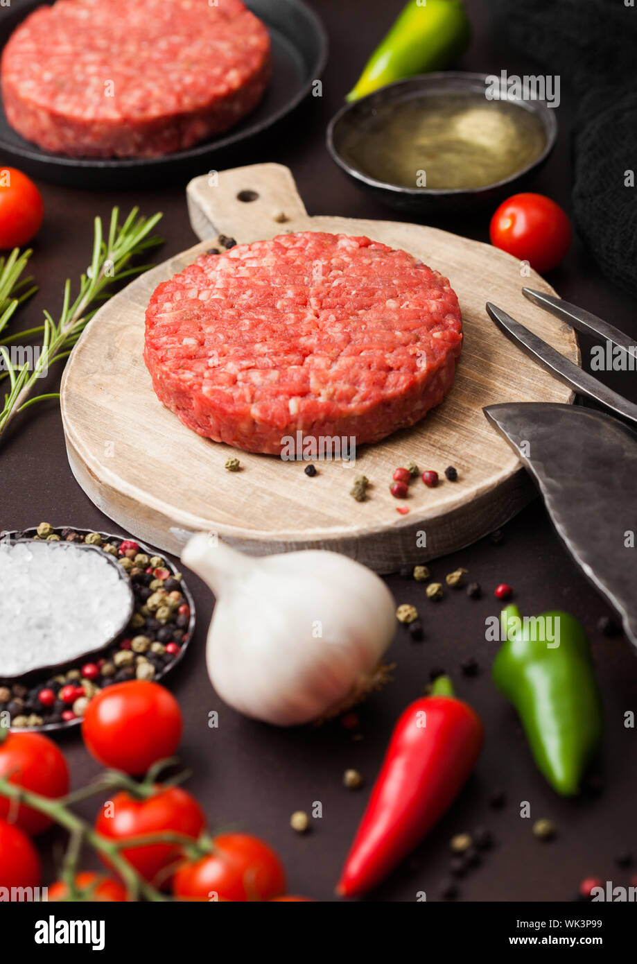 Fresh raw minced homemade farmers grill beef burger on round chopping ...